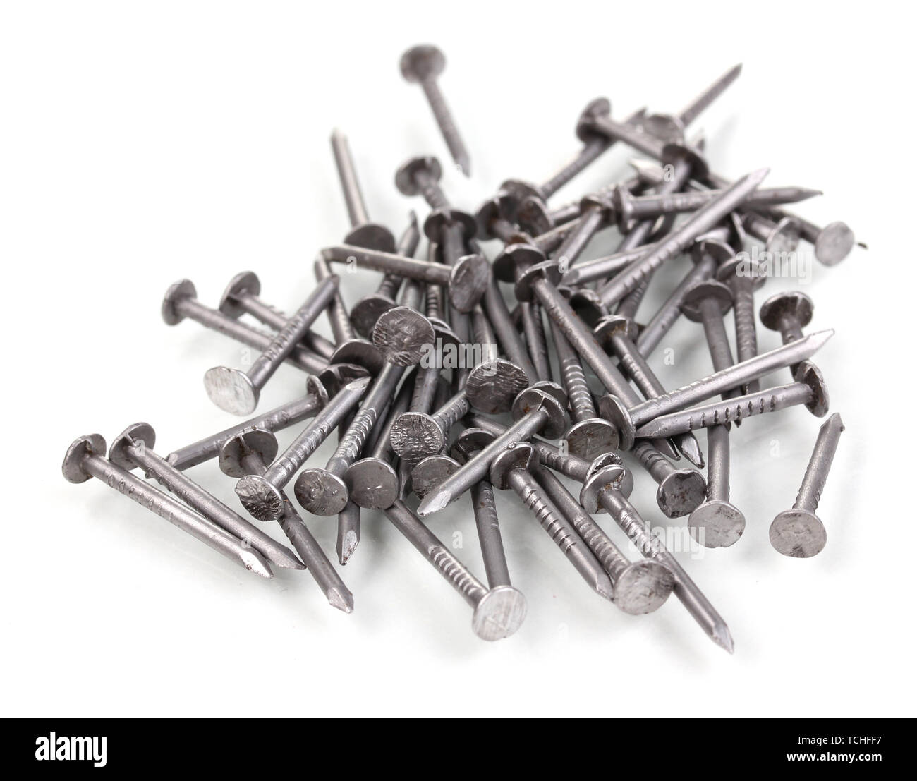 Metal nails isolated on white Stock Photo - Alamy