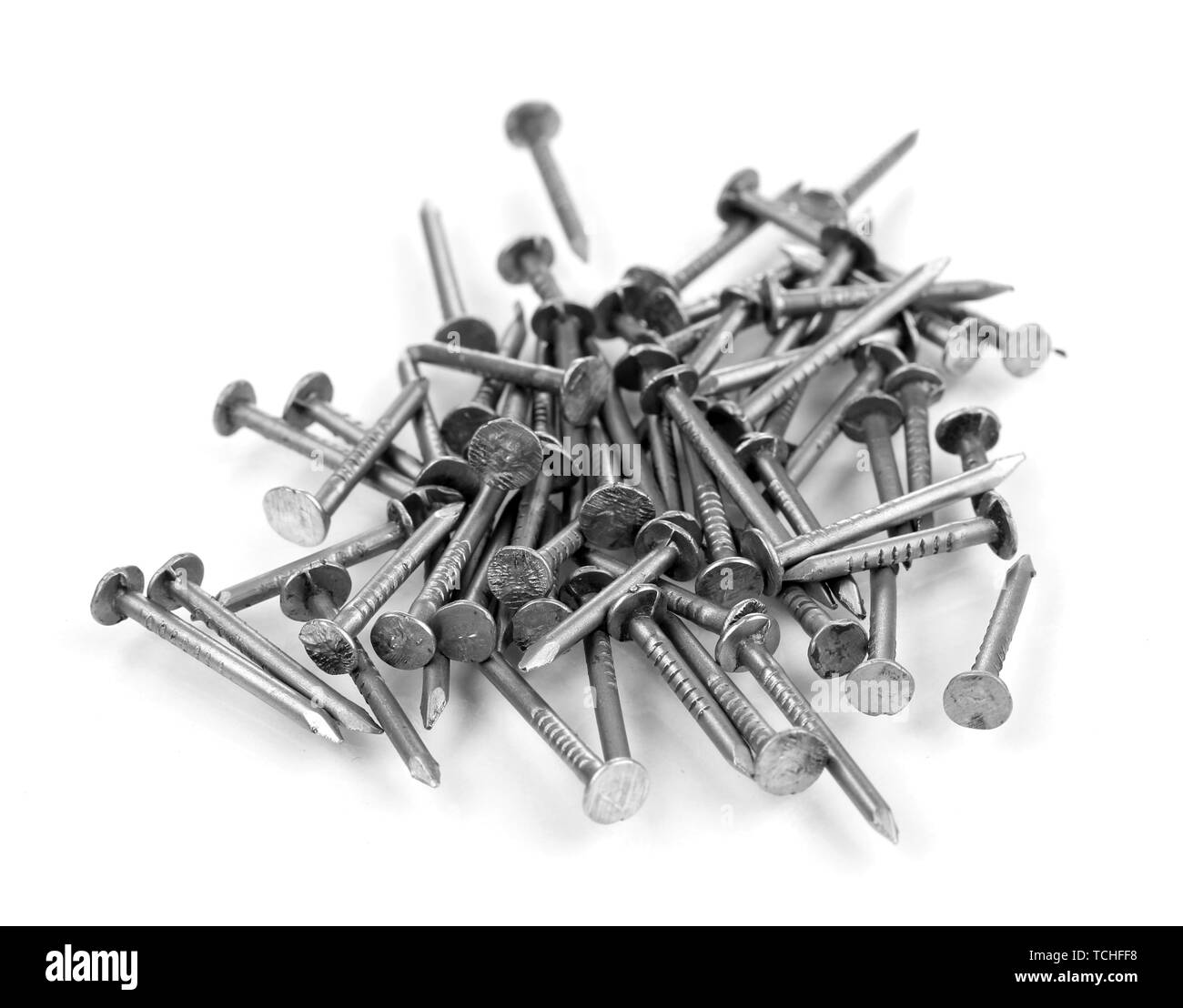Metal nails isolated on white Stock Photo - Alamy