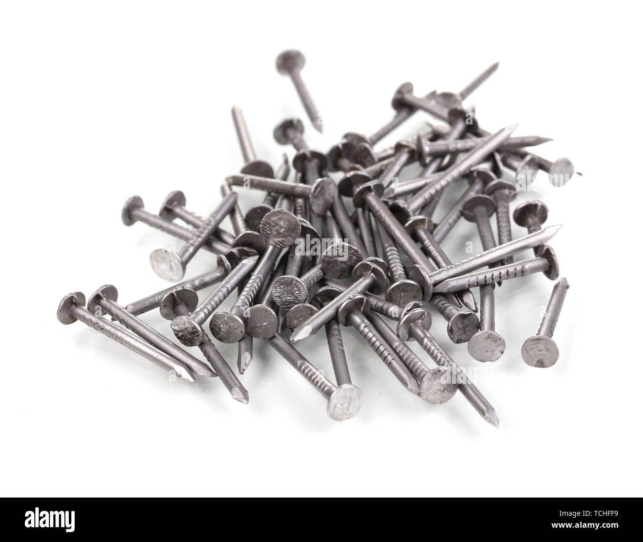 Metal nails isolated on white Stock Photo - Alamy