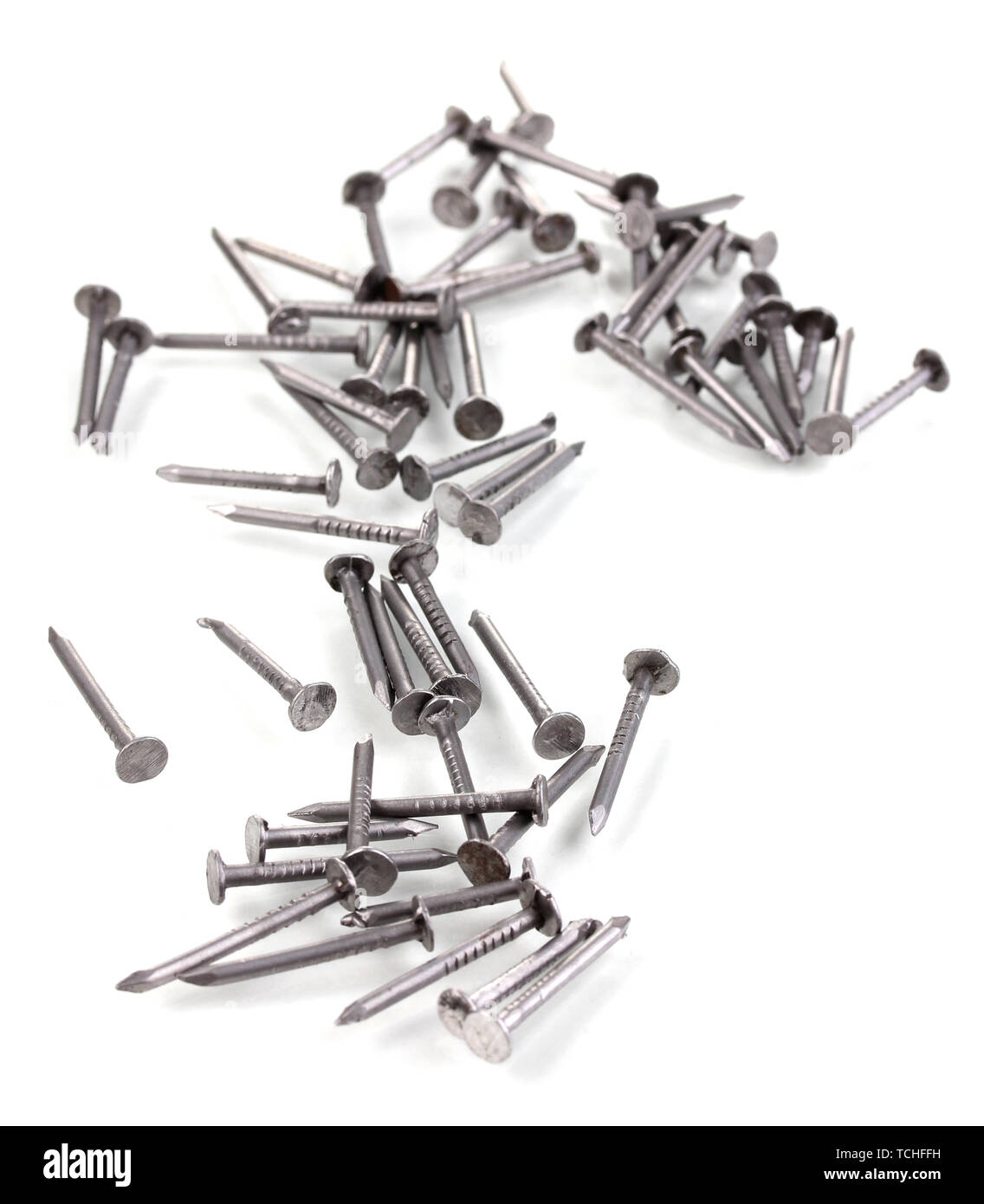 Metal nails isolated on white Stock Photo - Alamy