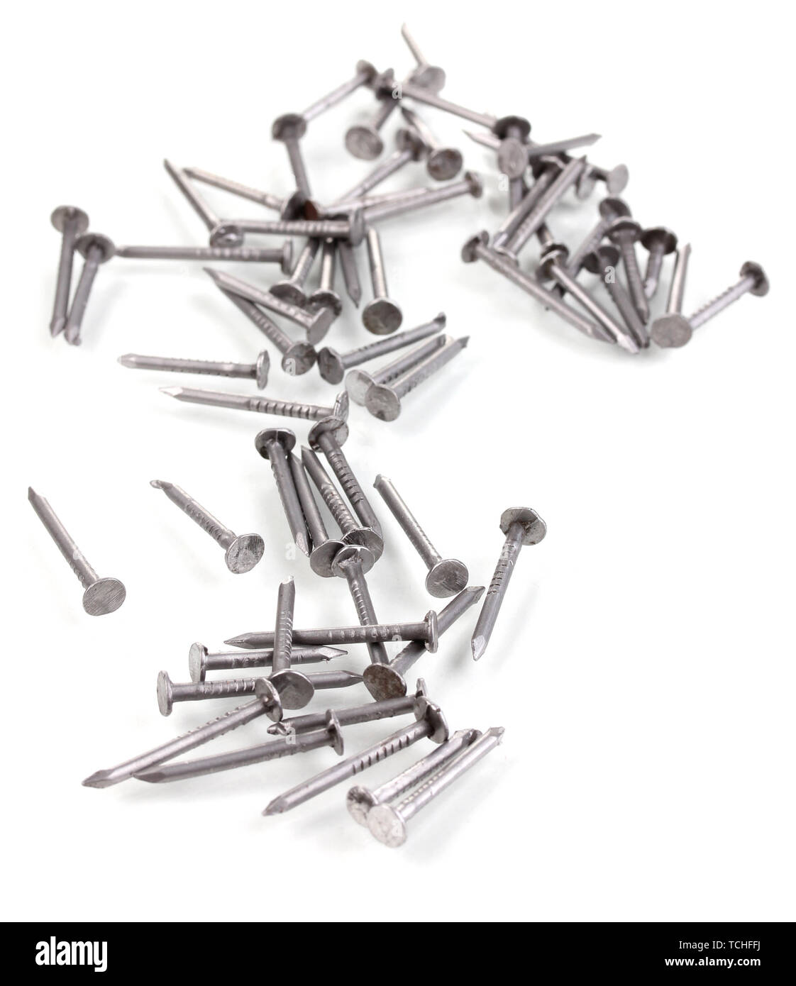 Metal nails isolated on white Stock Photo - Alamy