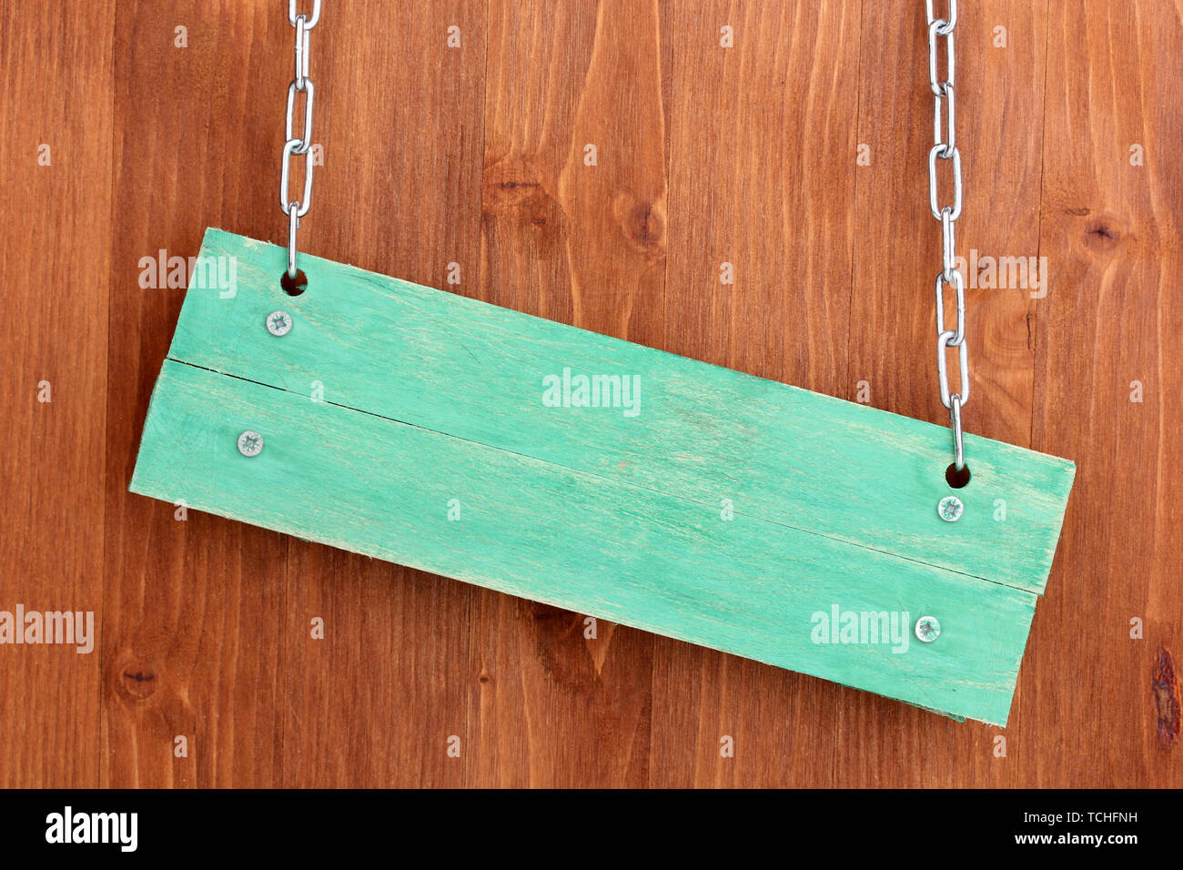 Color wooden sign board on wooden background Stock Photo - Alamy