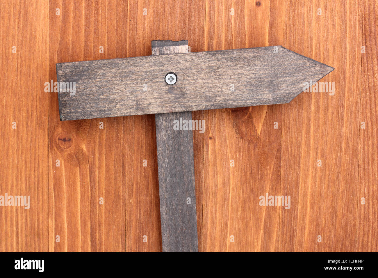 Color wooden sign board on wooden background Stock Photo - Alamy