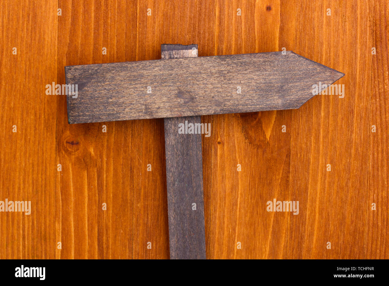 Color wooden sign board on wooden background Stock Photo - Alamy