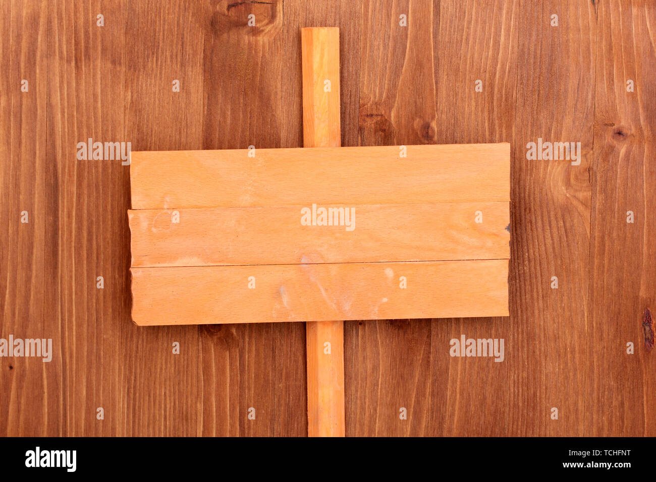 Color wooden sign board on wooden background Stock Photo - Alamy