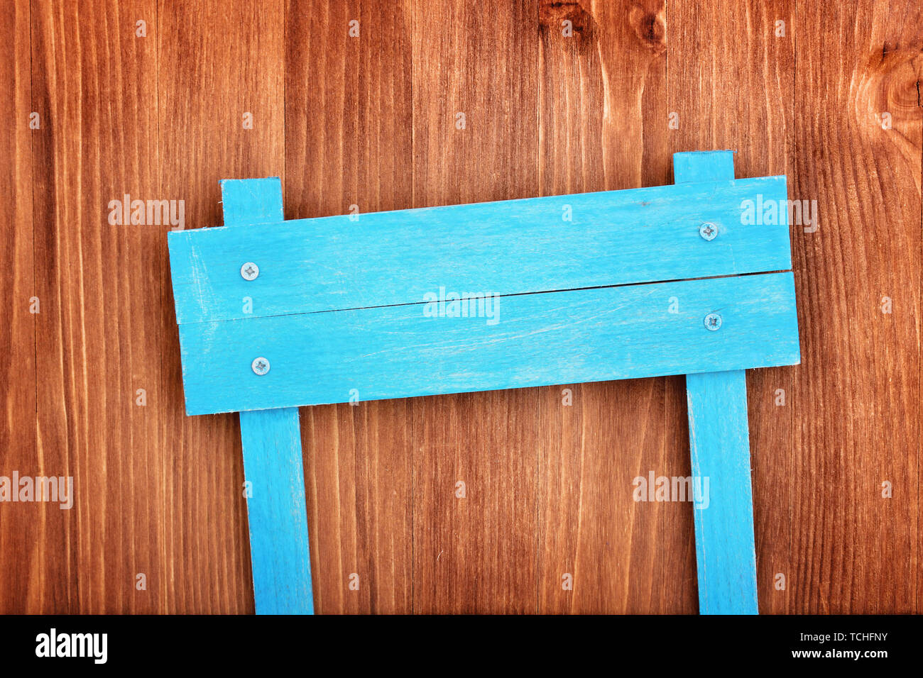 Color wooden sign board on wooden background Stock Photo - Alamy