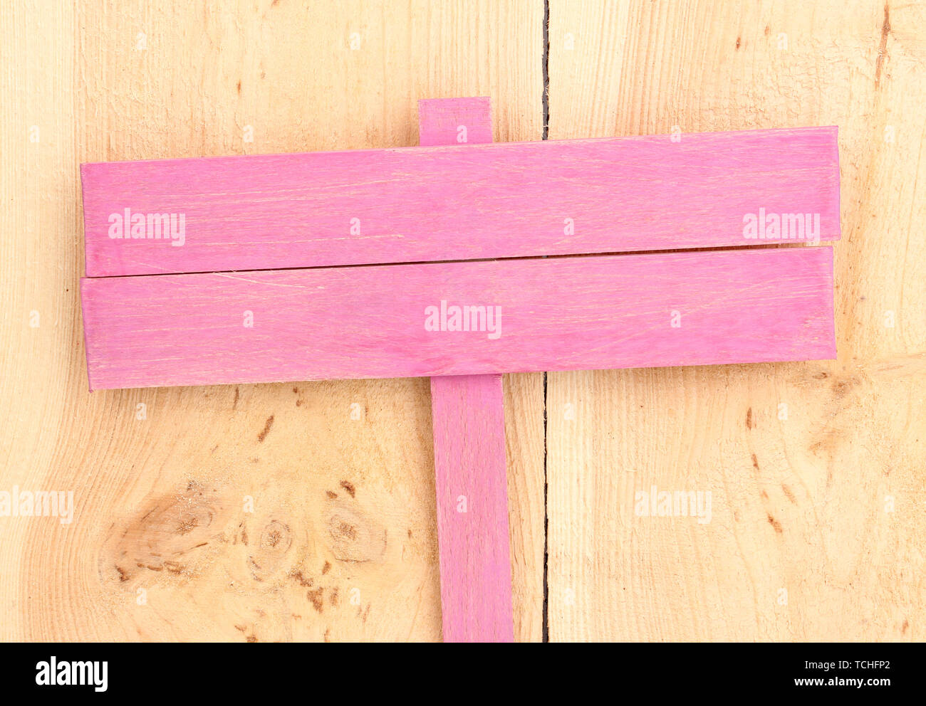 Color wooden sign board on wooden background Stock Photo - Alamy