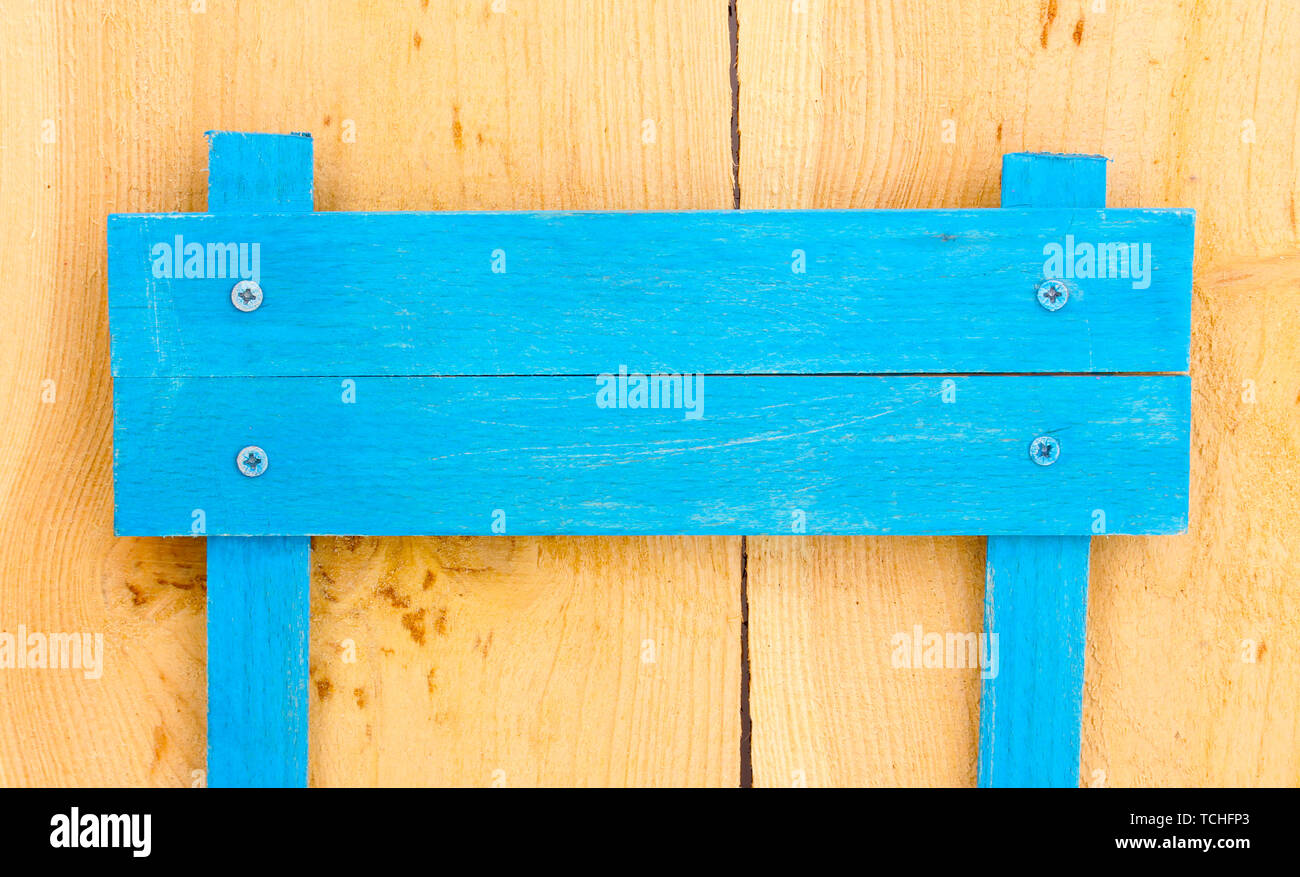 Color wooden sign board on wooden background Stock Photo - Alamy