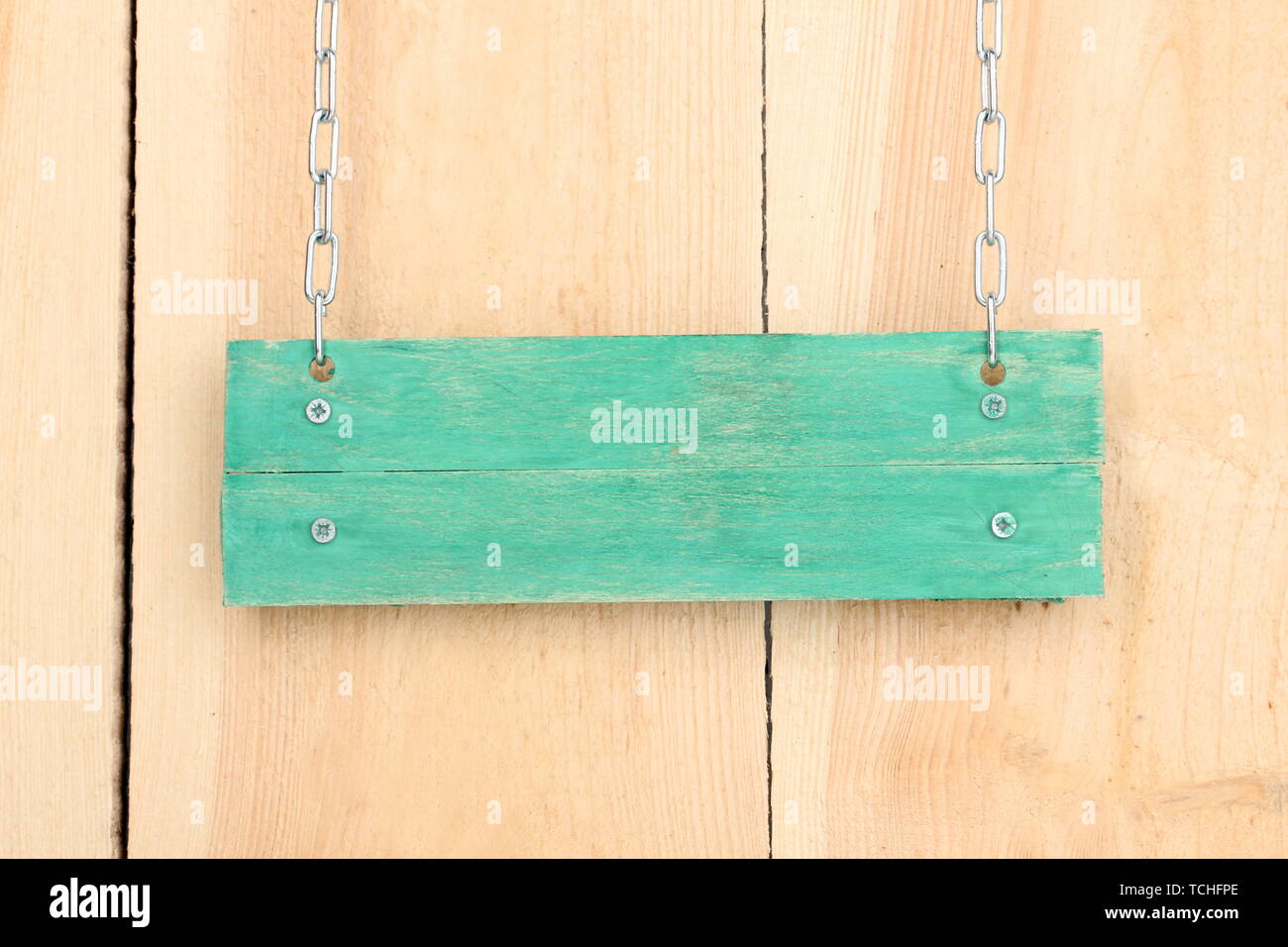 Color wooden sign board on wooden background Stock Photo - Alamy