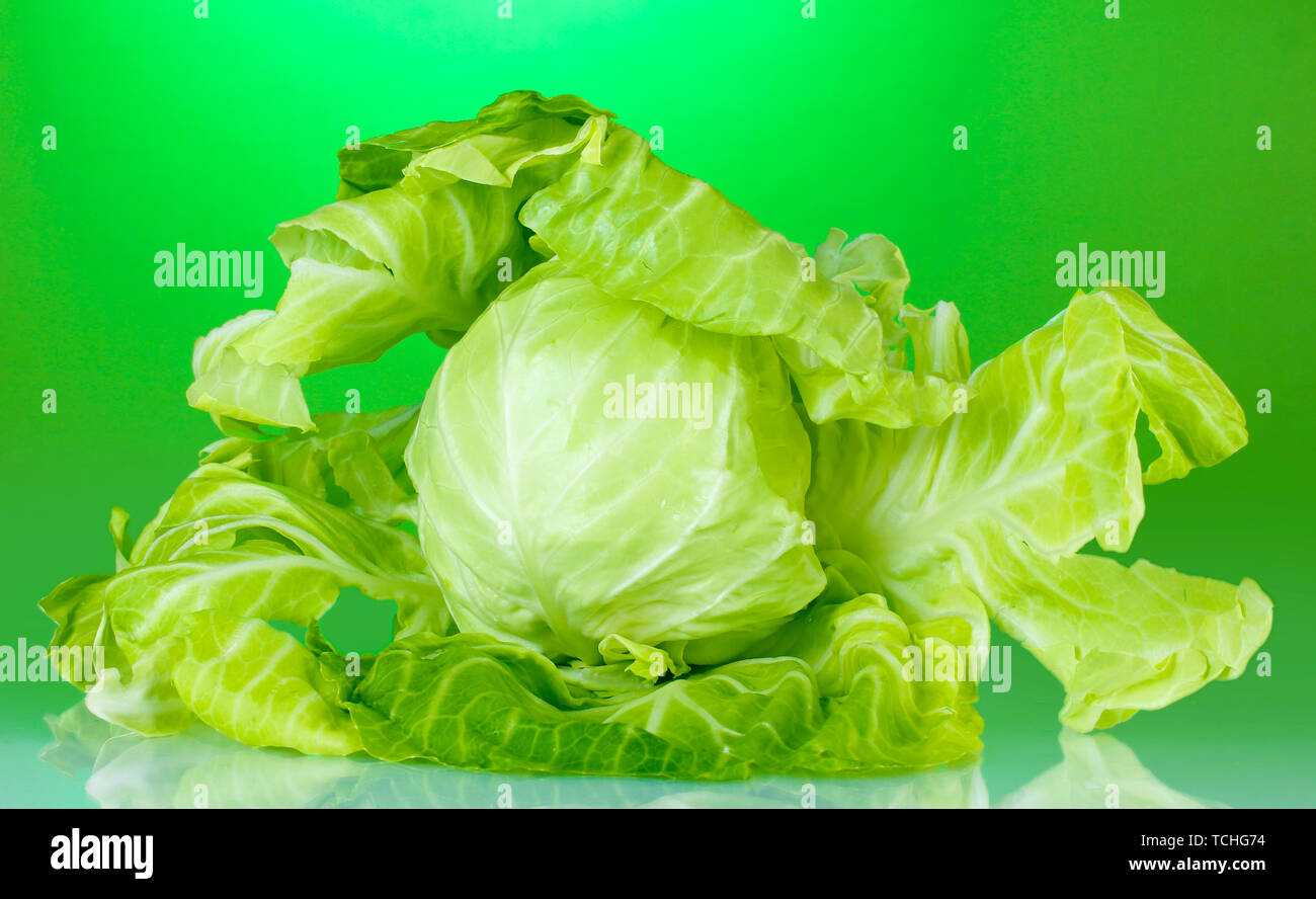 Cabbage on bright green background Stock Photo - Alamy