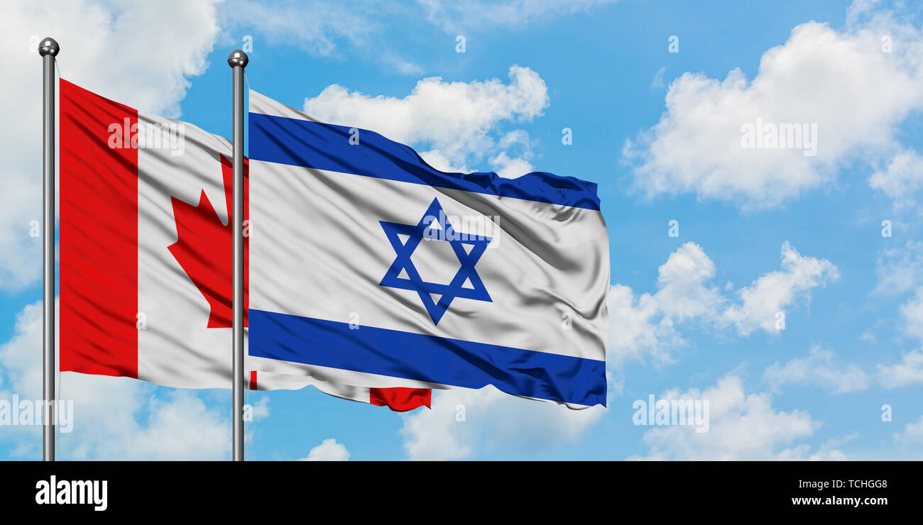 Canada and Israel flag waving in the wind against white cloudy blue sky ...