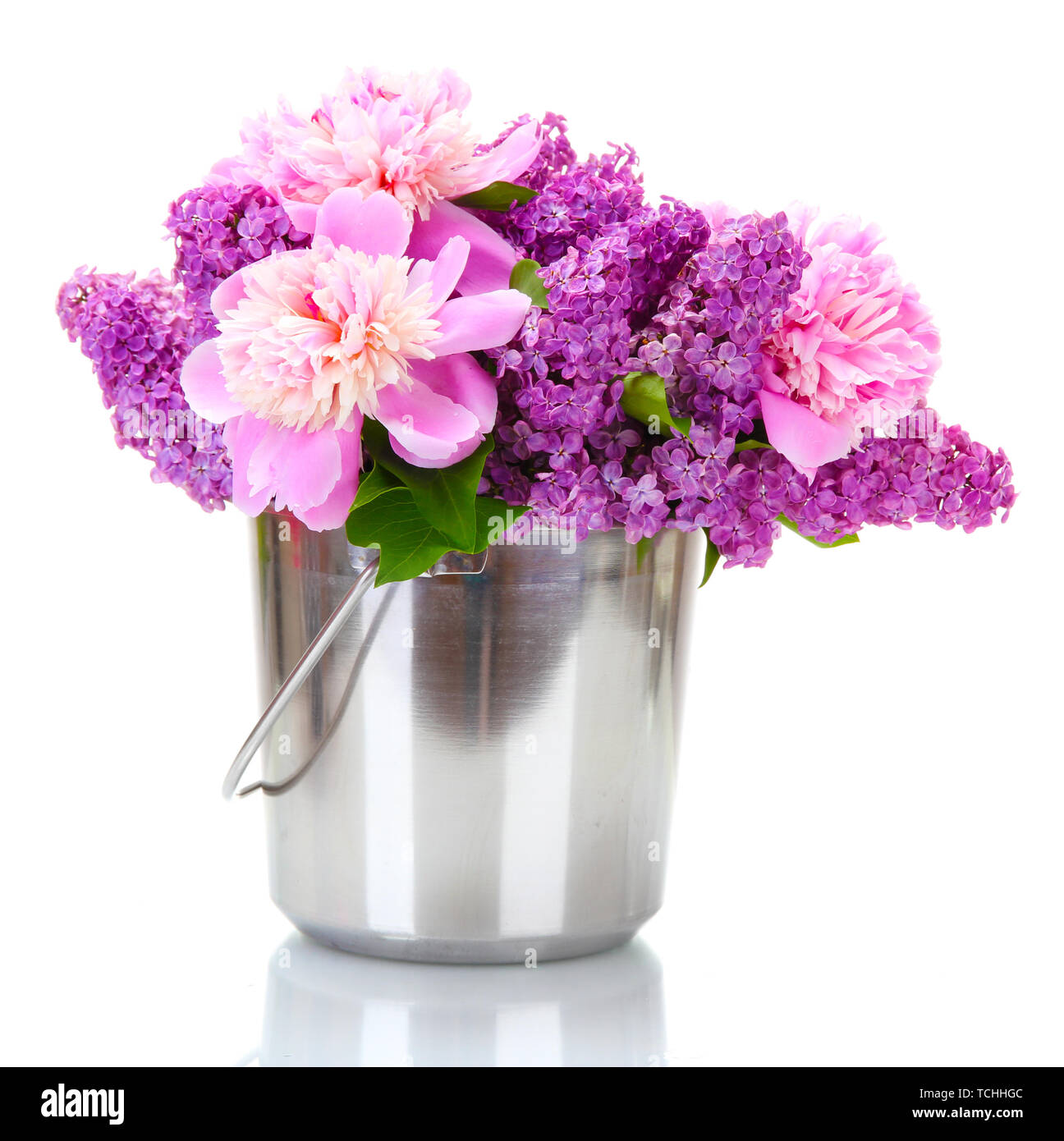 beautiful lilac and peonies flowers in metal bucket isolated on white ...