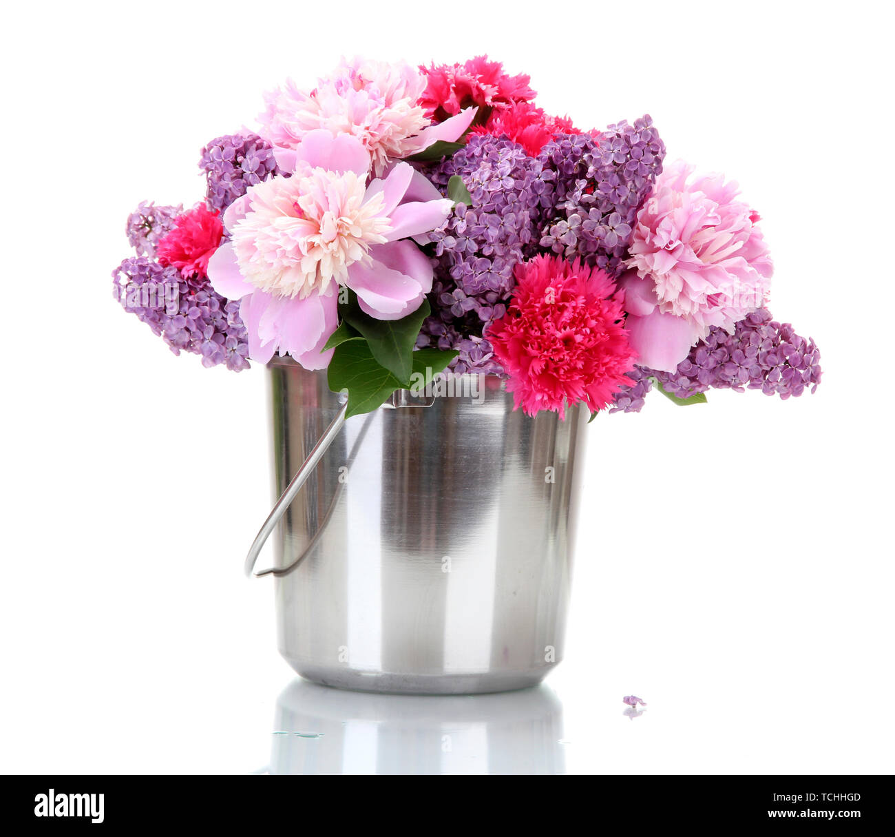 beautiful spring flowers in metal bucket isolated on white Stock Photo ...