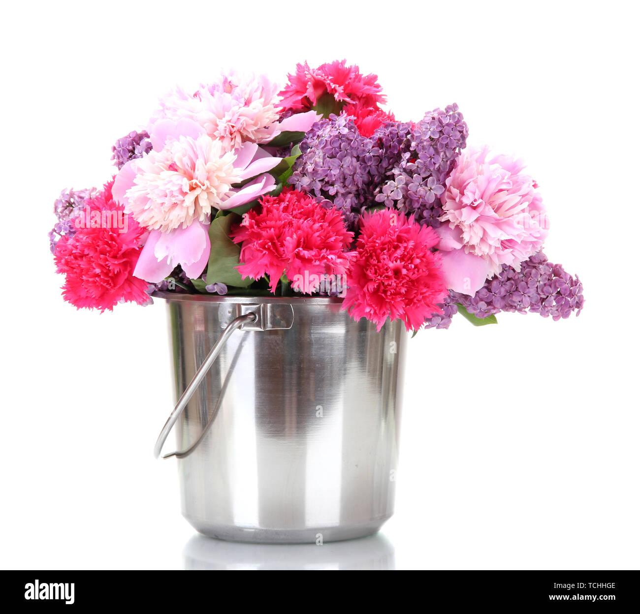 beautiful spring flowers in metal bucket isolated on white Stock Photo ...