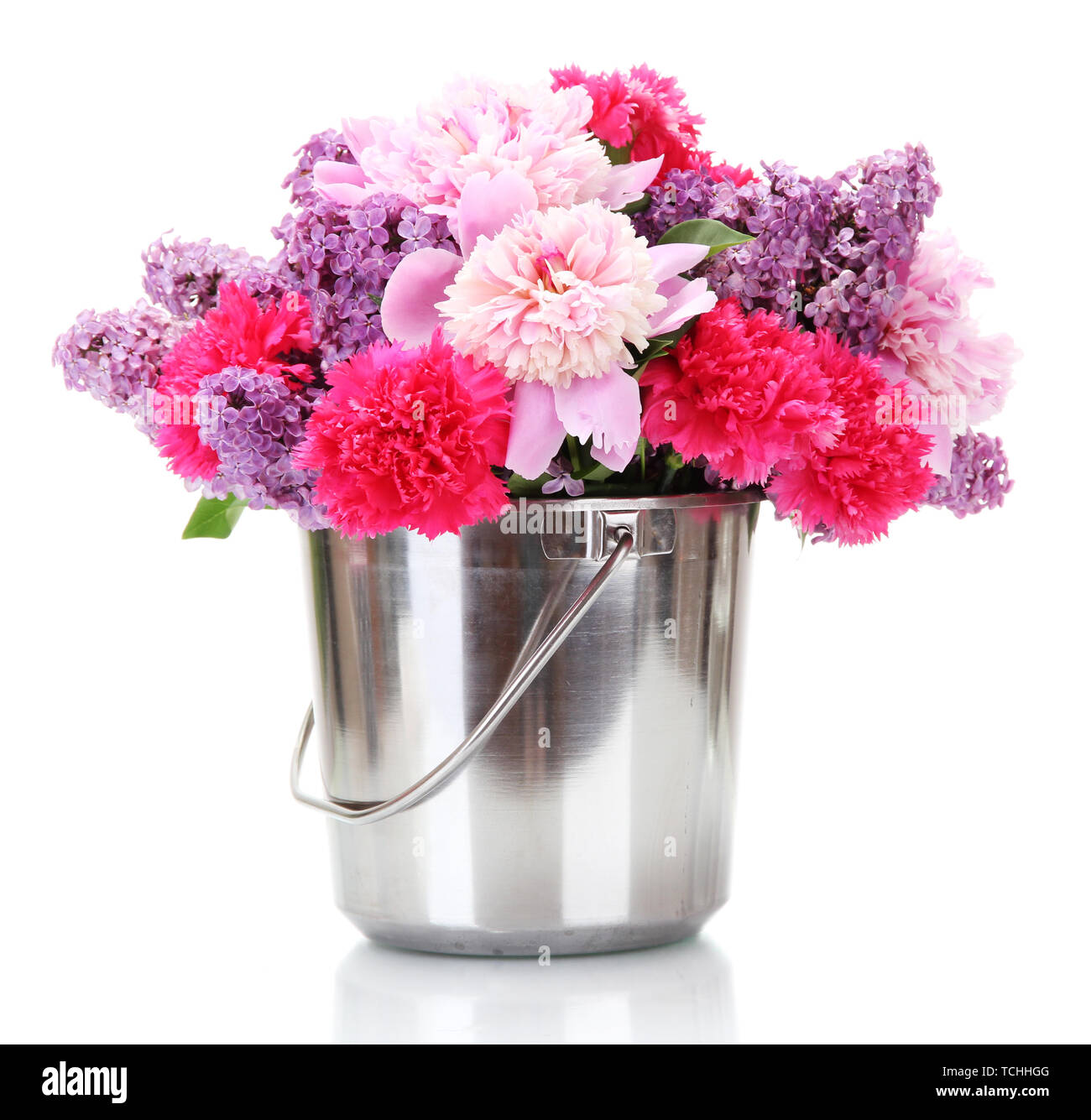 beautiful spring flowers in metal bucket isolated on white Stock Photo ...