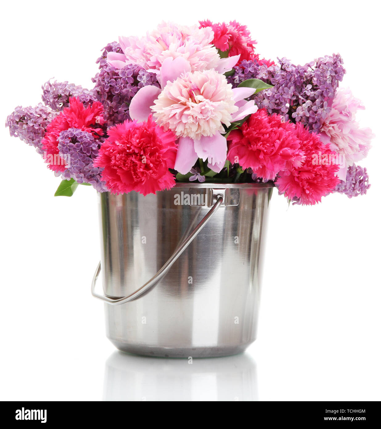 beautiful spring flowers in metal bucket isolated on white Stock Photo ...