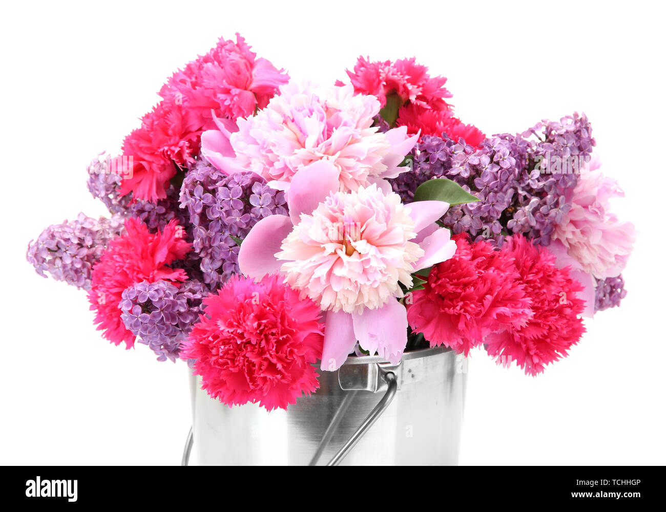 beautiful spring flowers in metal bucket isolated on white Stock Photo ...