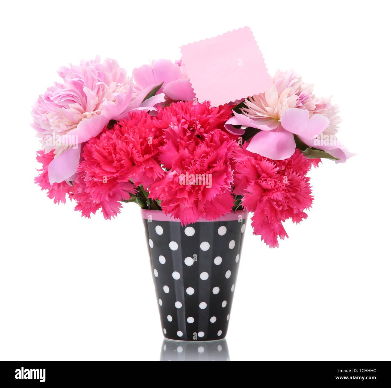 beautiful spring flowers in cup isolated on white Stock Photo - Alamy