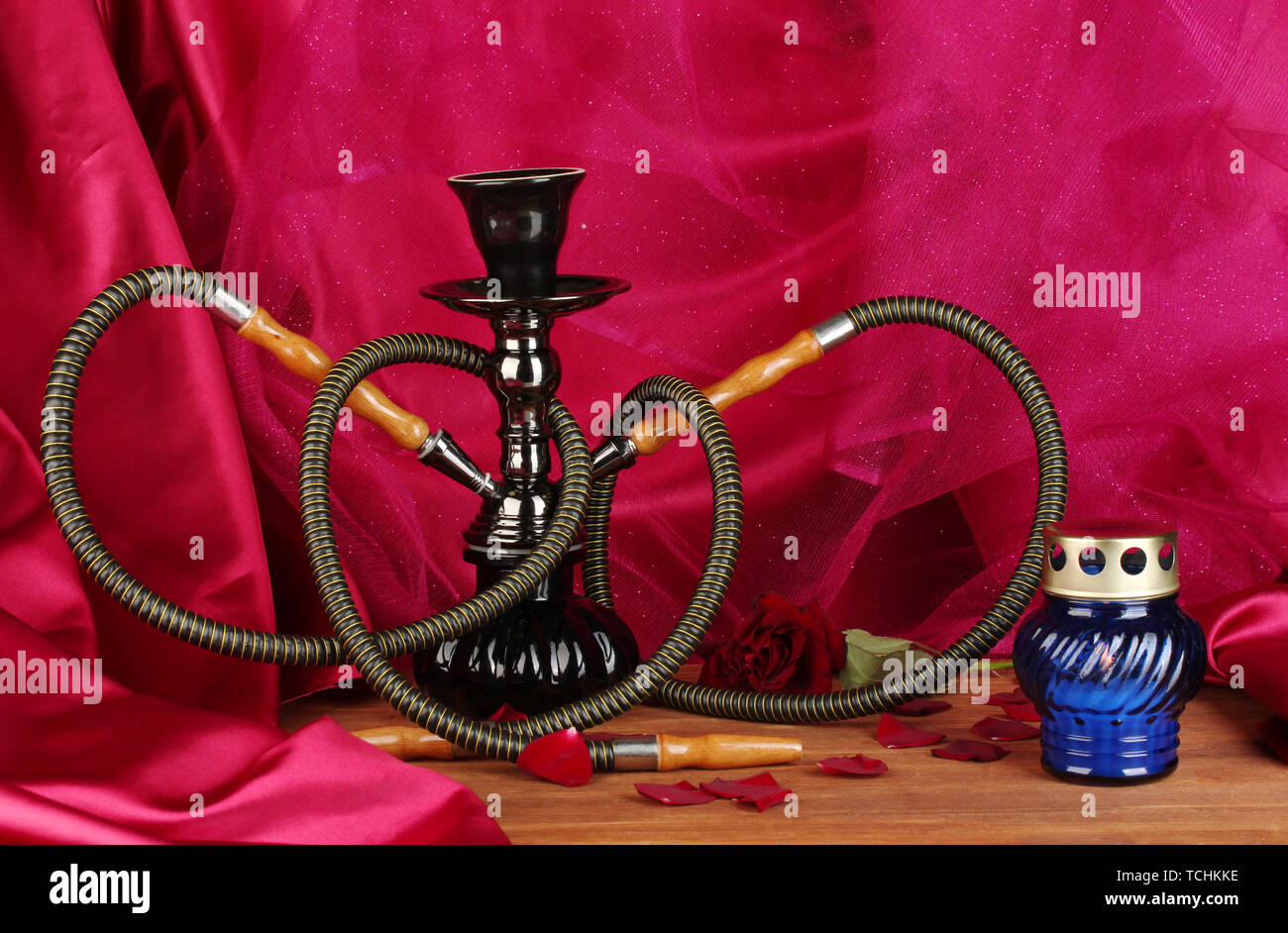 hookah on a wooden table on a background of red curtain close-up Stock ...