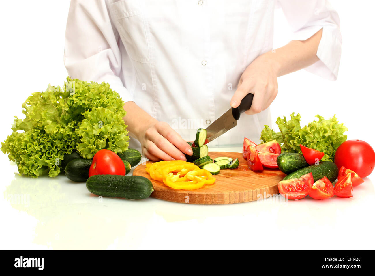 Hand cutting fresh red Cut Out Stock Images & Pictures - Alamy