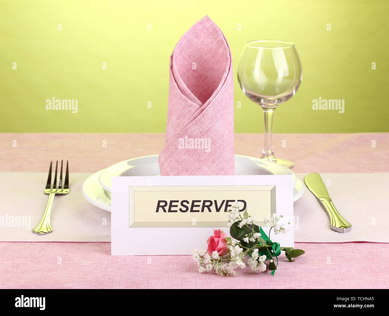 Table setting with reserved card in restaurant Stock Photo - Alamy