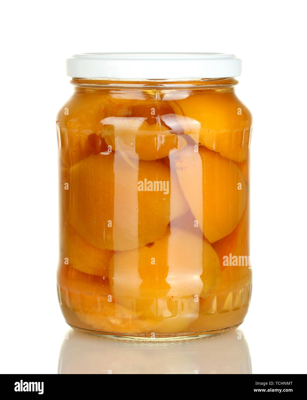 Jar of canned apricots isolated on white Stock Photo - Alamy