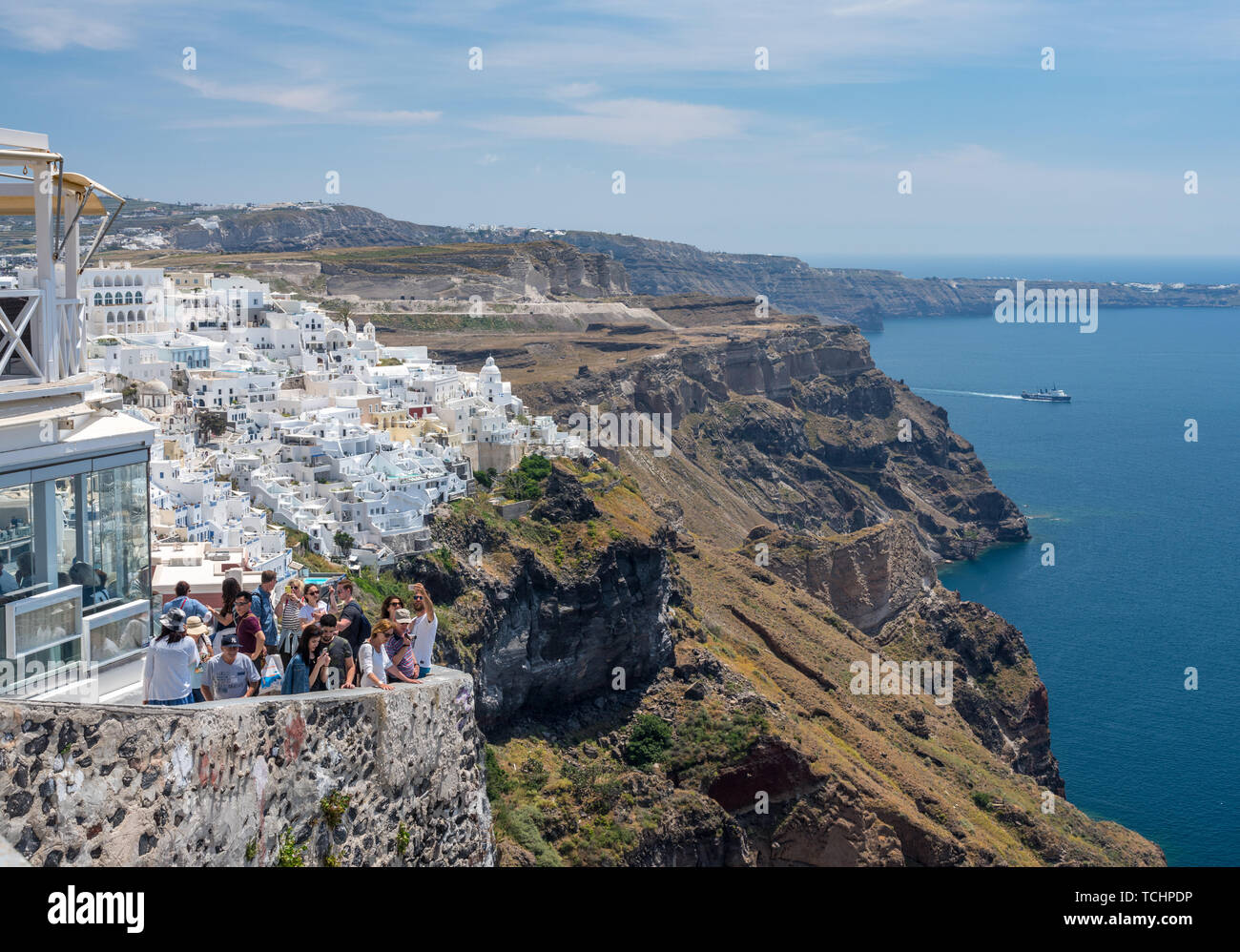 Tourists crowded on cliff in Fira Santorini Stock Photo - Alamy