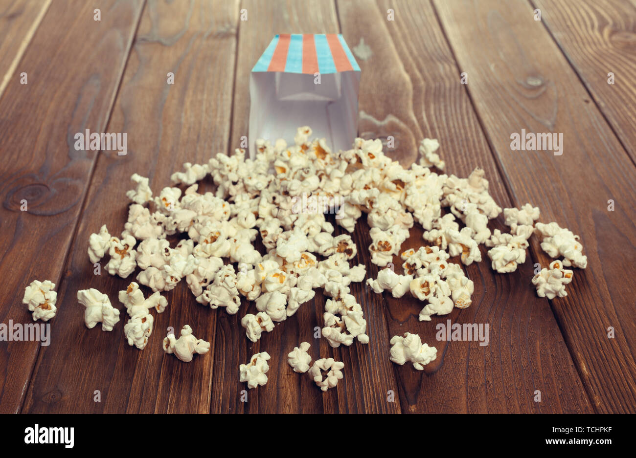Salt popcorn on the wooden table Stock Photo - Alamy