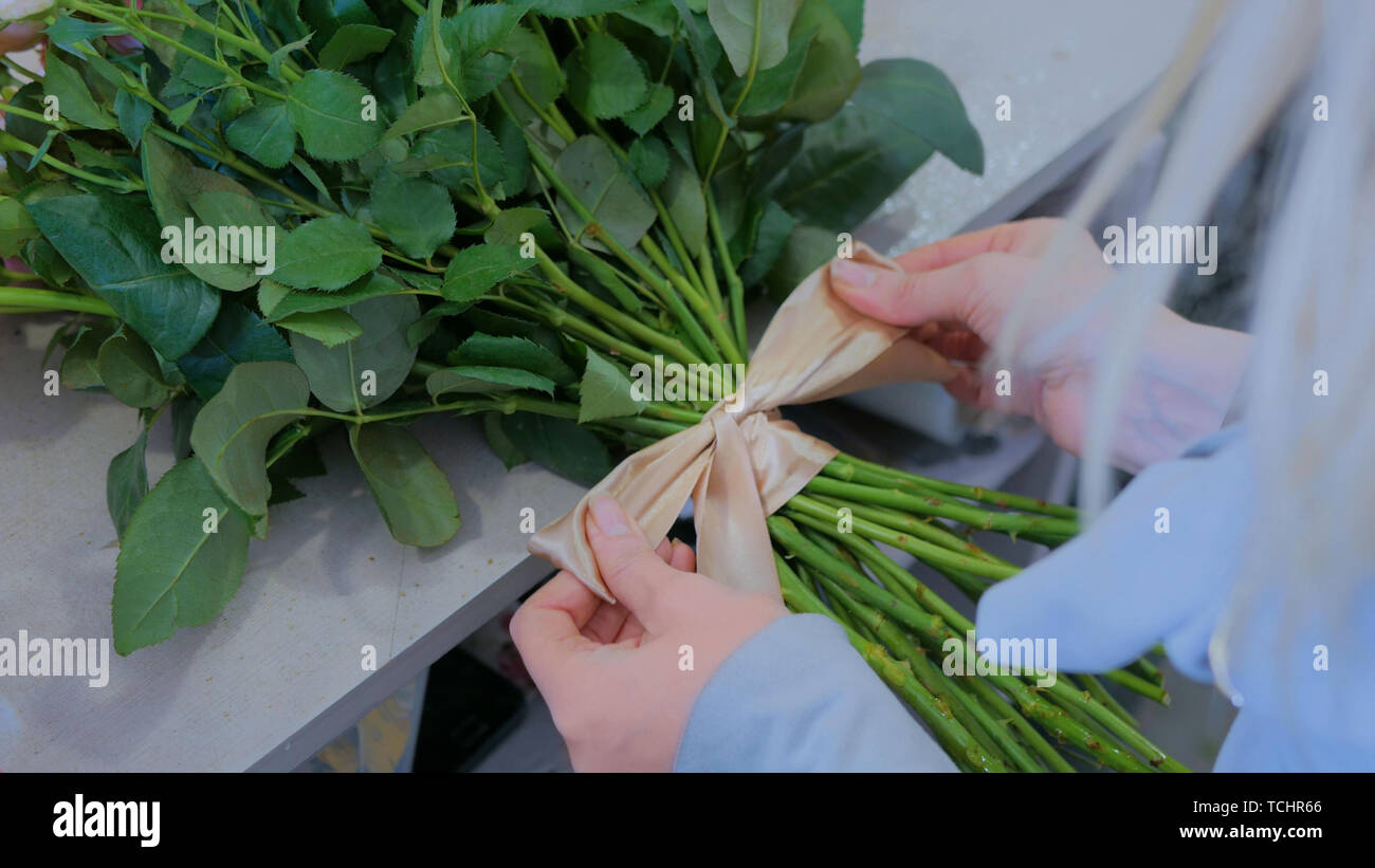 Wrapping hand and arm hi-res stock photography and images - Alamy