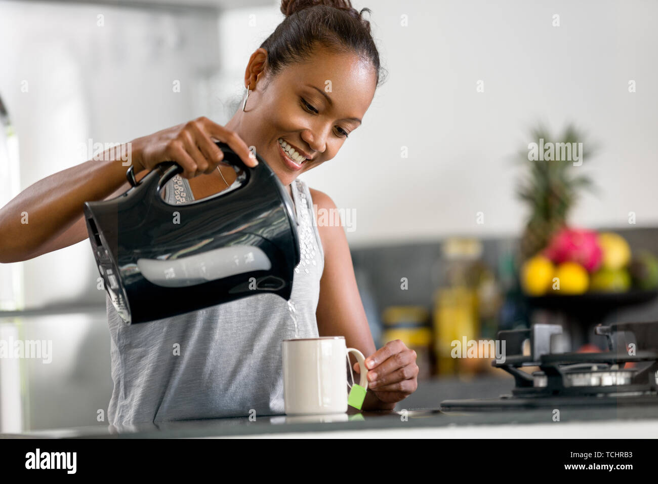 Indonesian woman making coffee in modern Indonesian woman making coffee ...