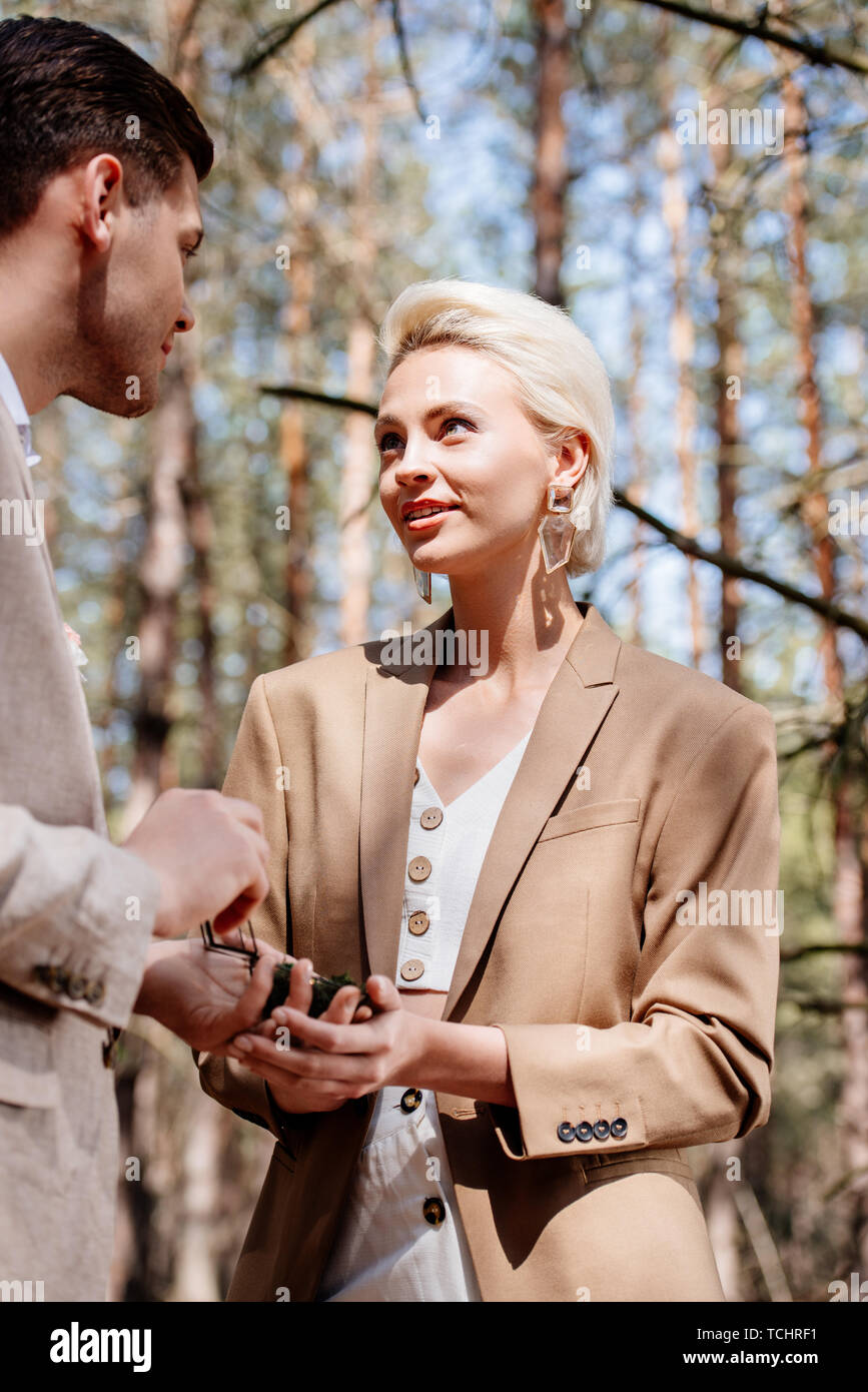 Beautiful and smiling woman accepting marriage proposal in forest Stock ...