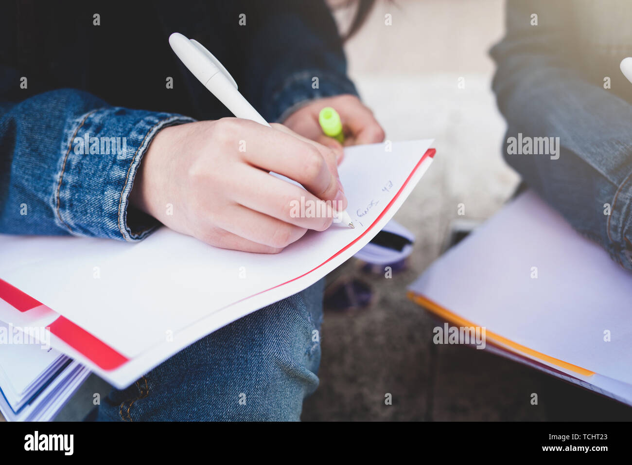 Students writing in notebooks hi-res stock photography and images - Alamy
