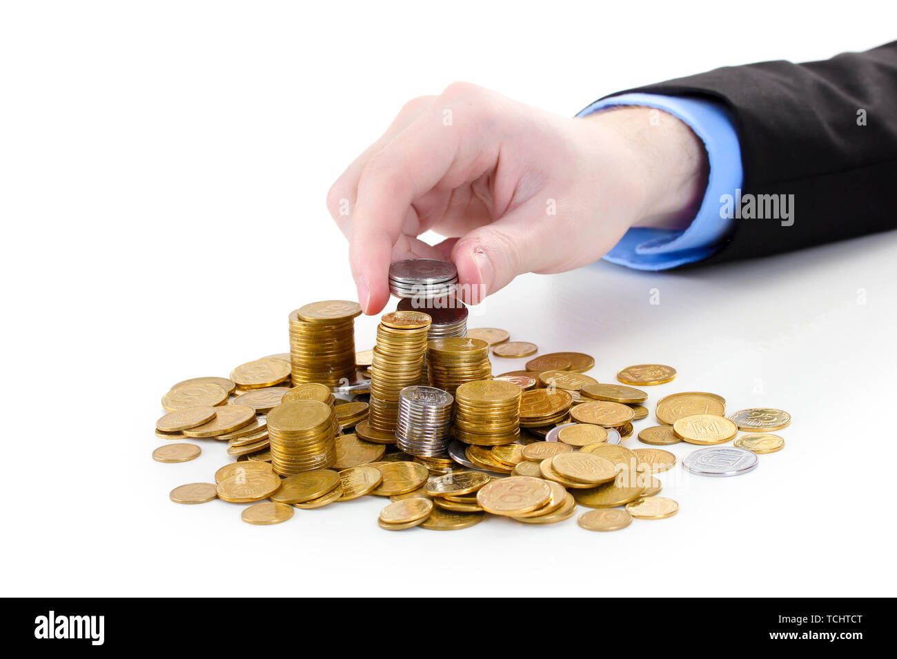 Businessman hand put coins isolated on white Stock Photo - Alamy