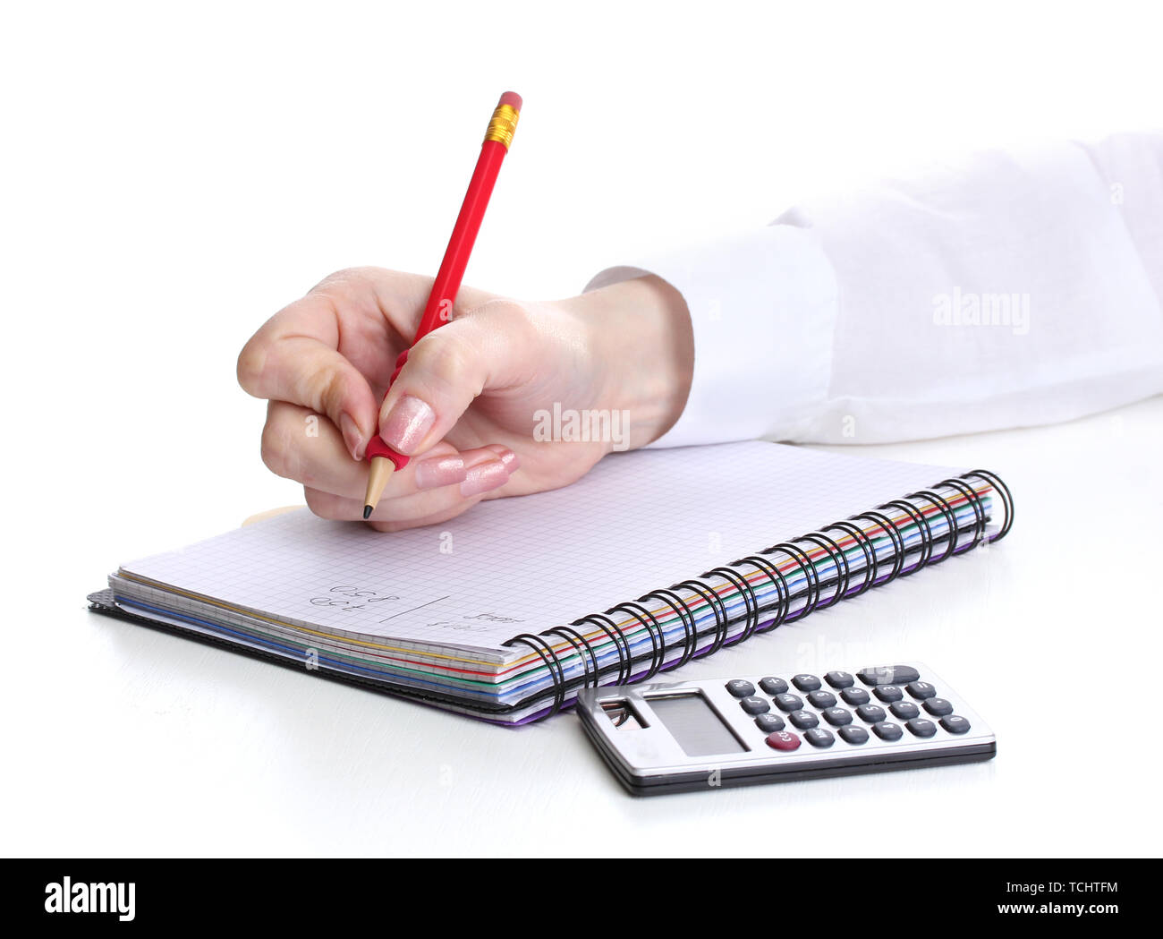 Hands working on calculator Cut Out Stock Images & Pictures - Alamy