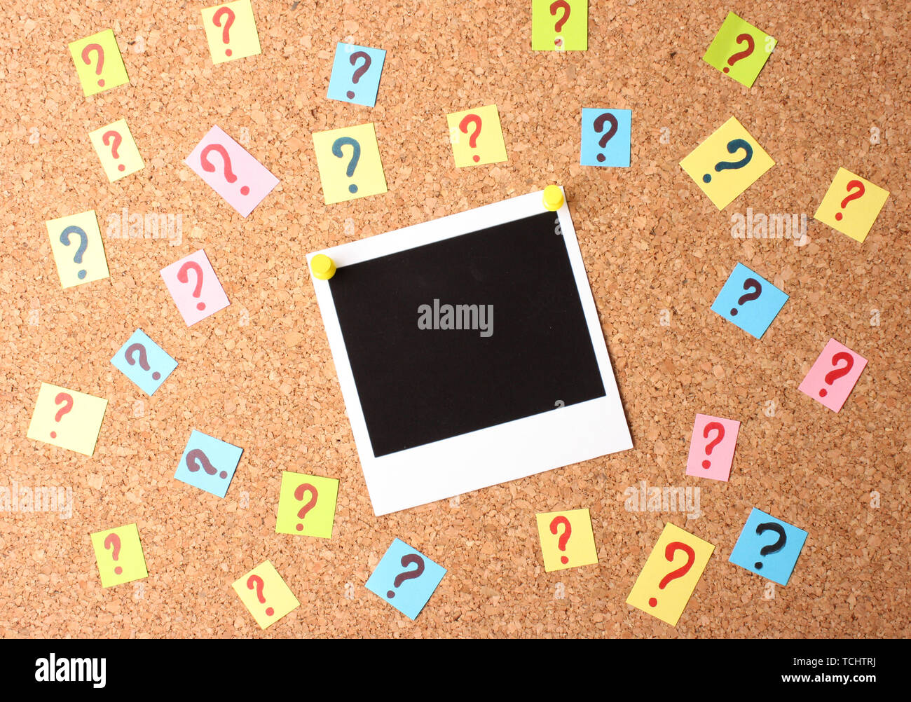 Photo with question marks cork board Stock Photo - Alamy