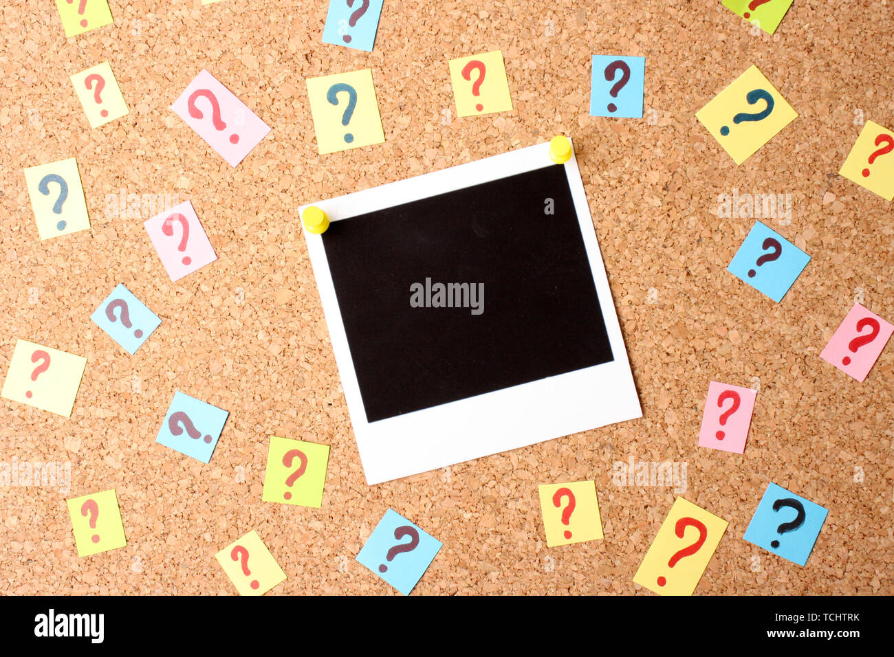 Photo with question marks cork board Stock Photo - Alamy