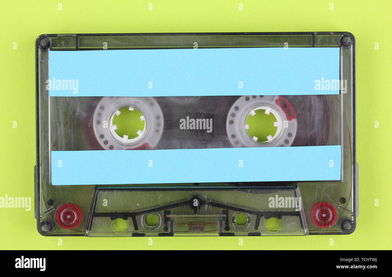 Audio cassette with color label on green background Stock Photo - Alamy