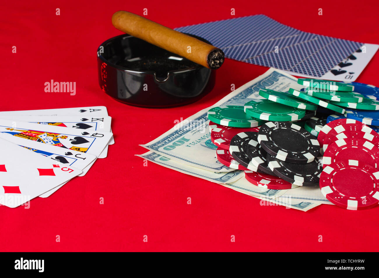 The red poker table with open playing cards Stock Photo - Alamy