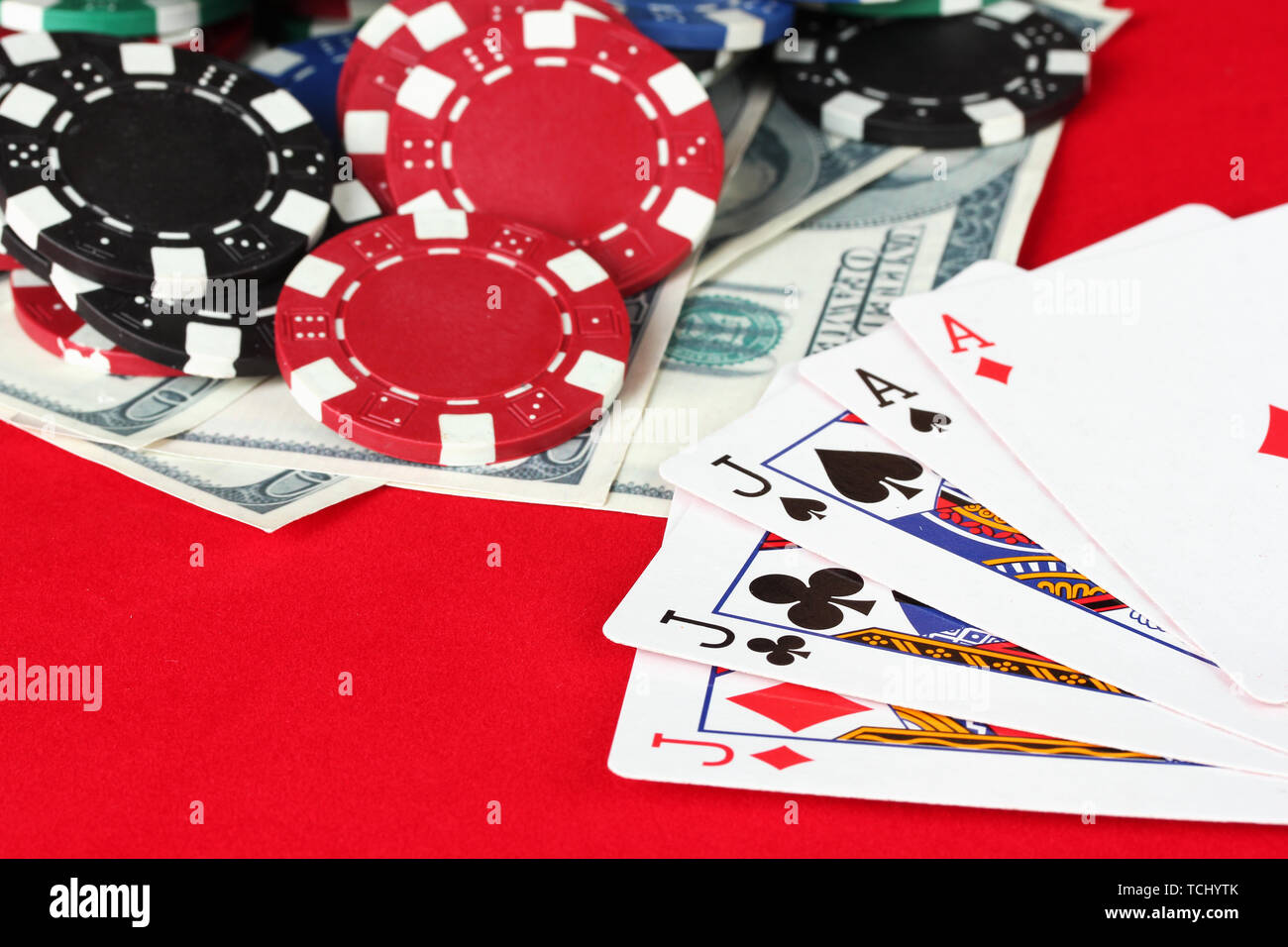 The red poker table with playing cards. The combination of full house ...