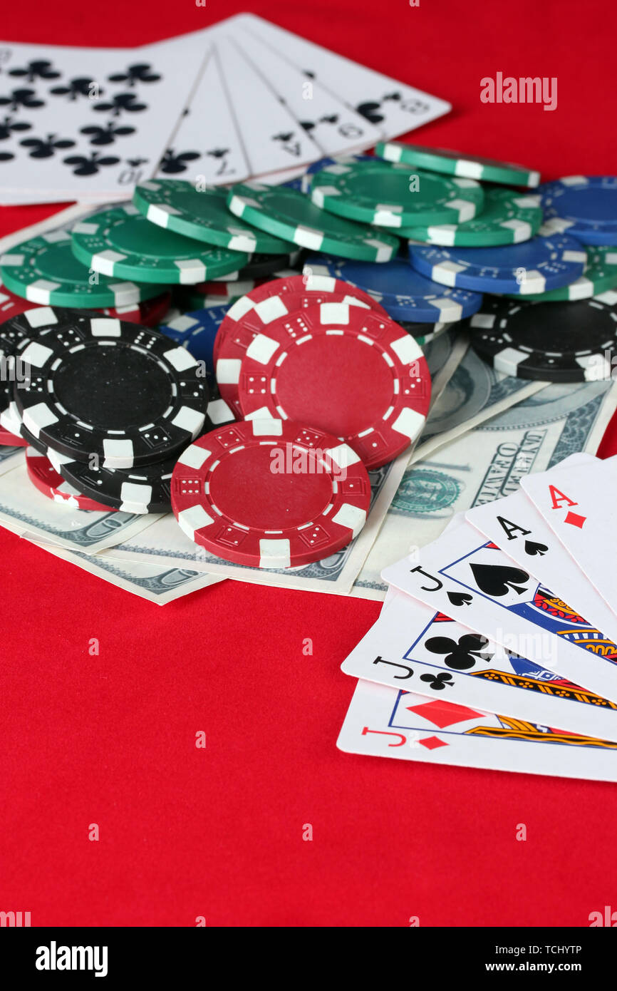 The red poker table with playing cards. The combination of full house ...