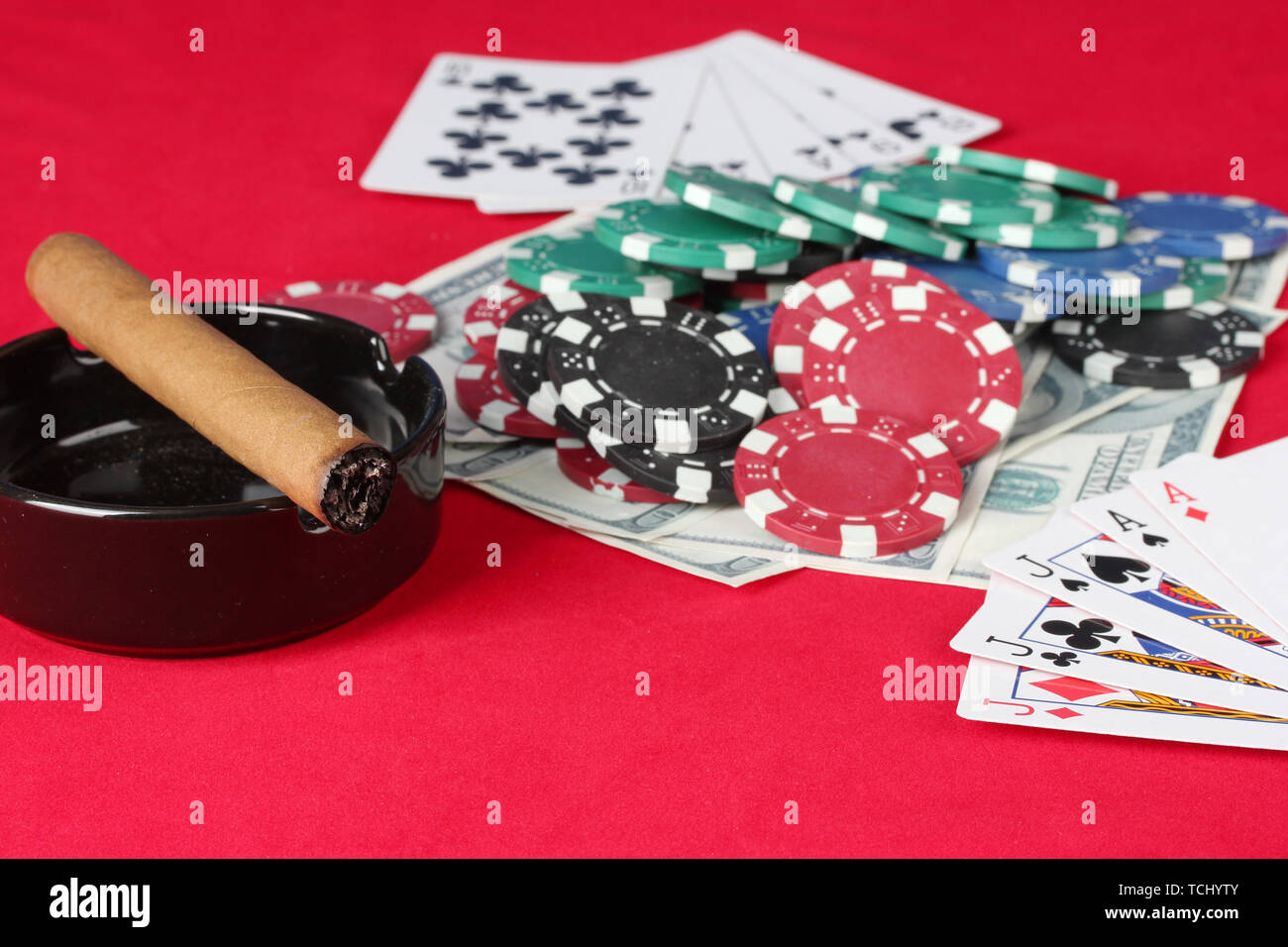 The red poker table with playing cards. The combination of full house ...