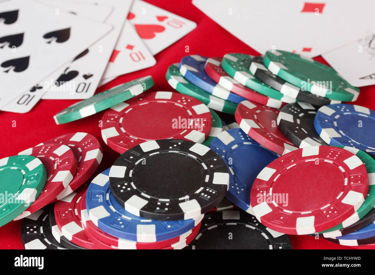 The red poker table with playing cards and poker chips Stock Photo - Alamy