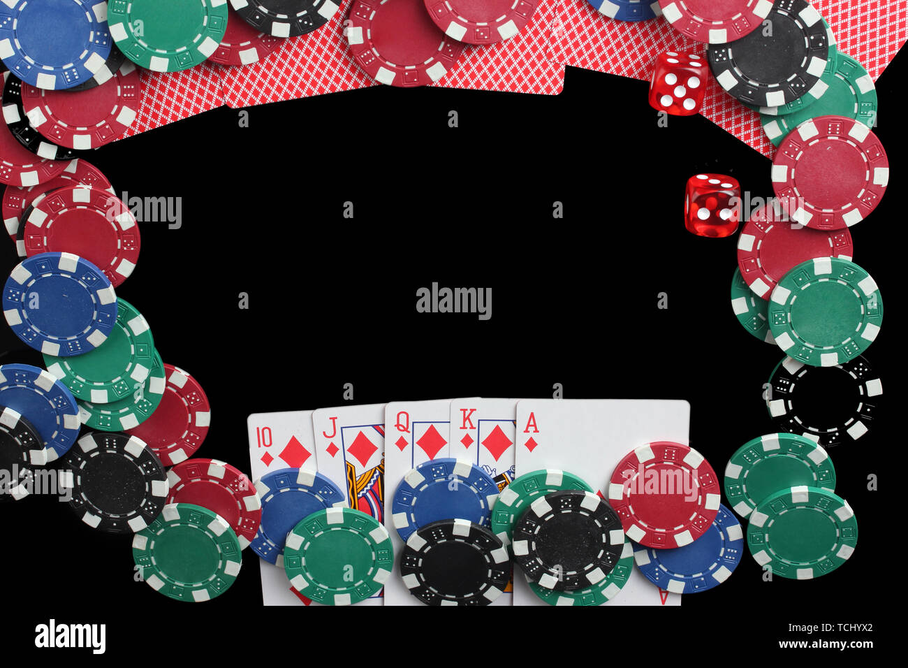 frame made of playing cards and poker chips on black background close ...