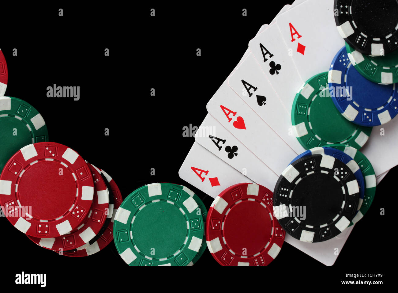 frame made of playing cards and poker chips on black background close ...