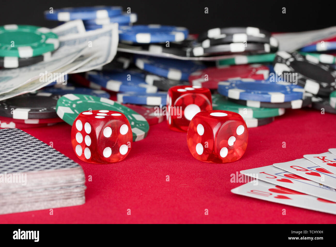 playing cards on a red poker table close-up Stock Photo - Alamy