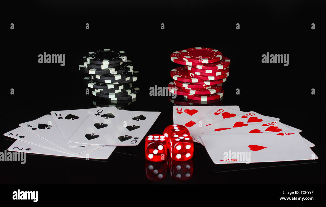 winning combination of playing cards with poker chips and dice on black ...