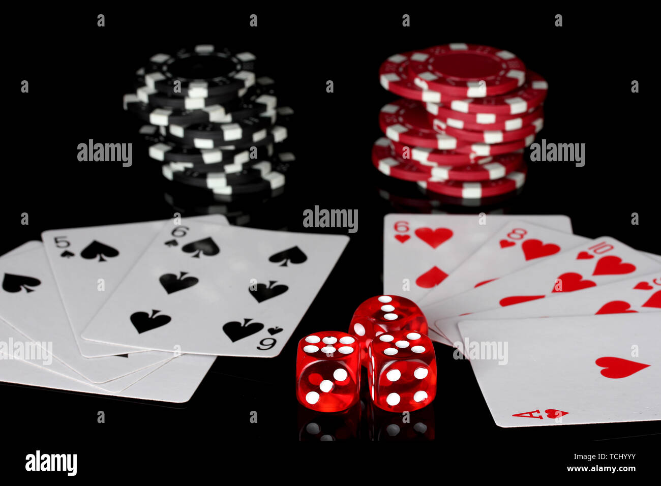 winning combination of playing cards with poker chips and dice on black ...
