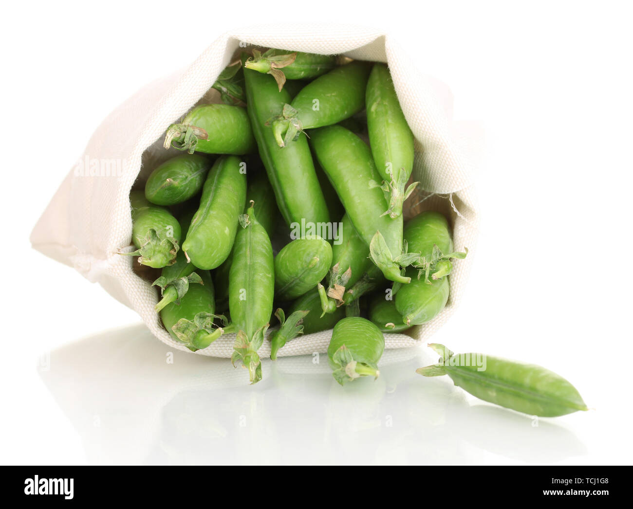 Green peas in bag isolated on white Stock Photo - Alamy
