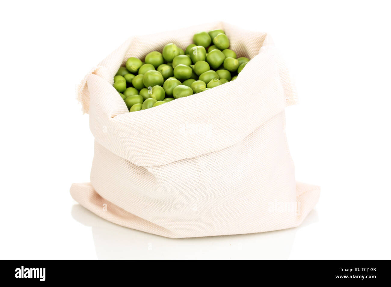 Green peas in bag isolated on white Stock Photo - Alamy