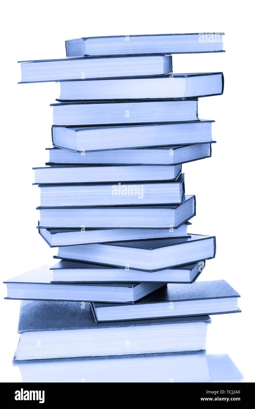 Stack of books in blue light Stock Photo - Alamy